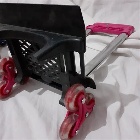 خرید و قیمت دسته چرخدار کیف مدرسه ای دارای 3چرخ ژله ای از غرفه غرفه