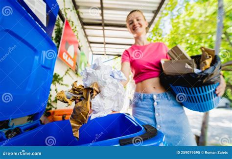 A Young Beautiful Girl Throws Sorted Garbage Into Special Bins Stock Image Image Of Hand