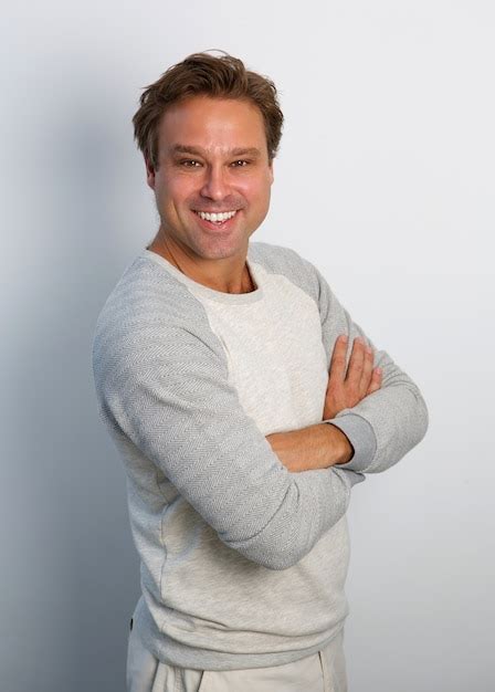 Premium Photo Friendly Man Smiling With Arms Crossed