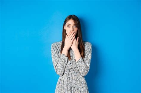 Premium Photo Portrait Of Woman Standing Against Blue Background