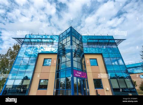 Low Angle View Of Office Building In Modern Design Glossy Glass Facade