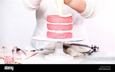 Step By Step Stacking Layers Together Of Pink Birthday Cake Stock