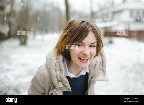 Cute Teen Girl Having Fun On A Walk In City Park On Chilly Winter Day