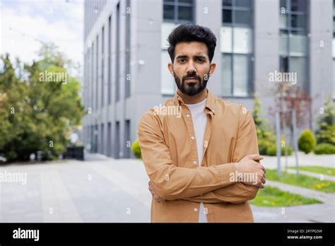 Serious Thinking Businessman Programmer Looking At Camera With Crossed Arms Indian Man Focused