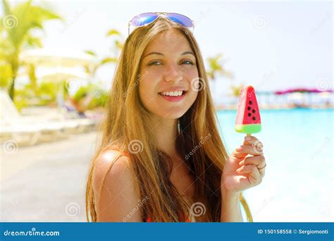 Happy Beautiful Girl Eating Popsicle Ice Pop In Form Of Watermelon