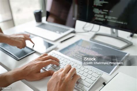 Development Programmer Writing A Code On Database Teamwork Cooperation