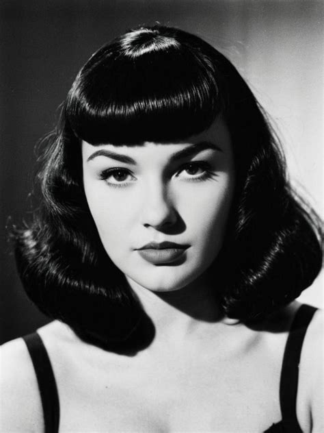 Vintage Style Woman With Bettie Page Bangs In Black And White Editorial