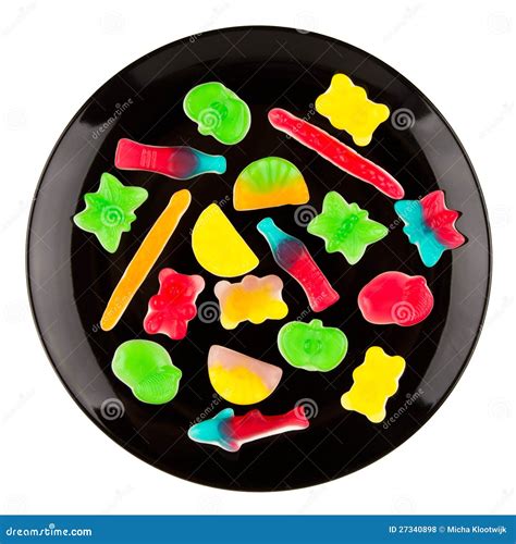 Colorful Candies In Many Different Shapes Isolated On A Black Pl Stock