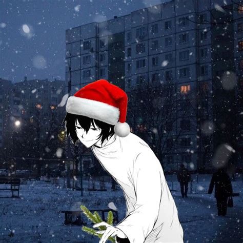 A Person Wearing A Santa Hat And Holding A Green Plant In The Snow At Night