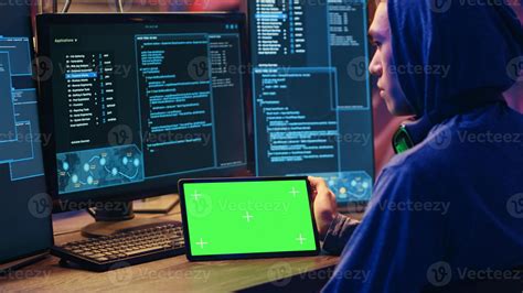 Hackers Doing Computer Sabotage Using Encryption Trojan Ransomware On Green Screen Tablet