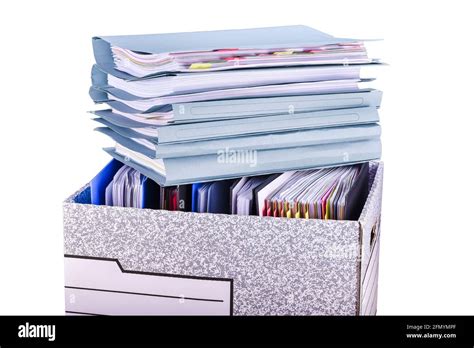 Documents And Files Folders Are Placed In A Paper Box And Pile Of Extra File Folders On Top