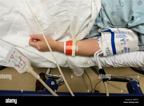 Blood Pressure Cuff On A Hospitalized Female Patient After Surgery Stock Photo Alamy