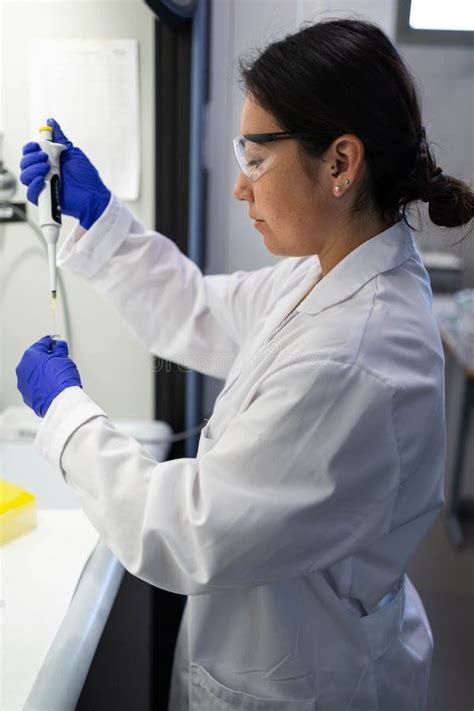 A Scientist Extracting A Liquid Sample Stock Image Image Of Chemical