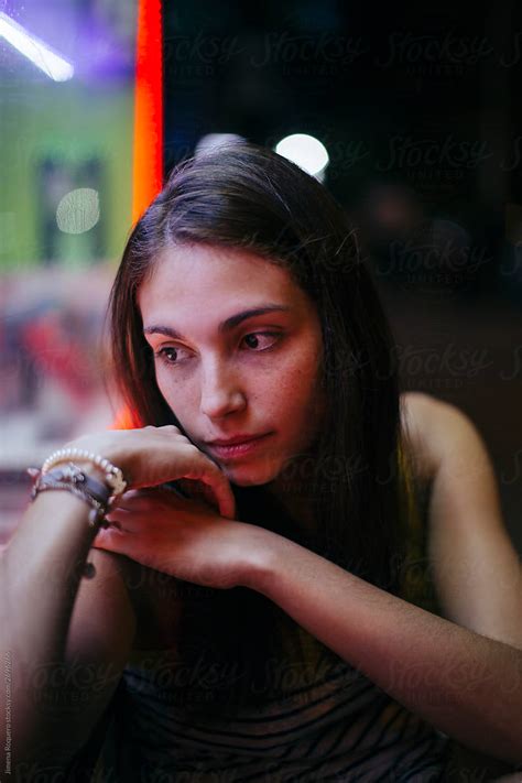 Pretty Young Girl Looking To The Left On Neon Pink Lights By Stocksy Contributor Jimena