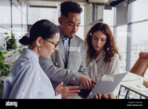 Engaging And Collaborative Business Meeting Taking Place In A Modern Office Setting Today Stock