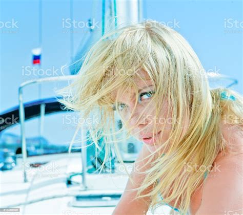 Beautiful Russian Blond Female Model Closeup On A Boat With Russian