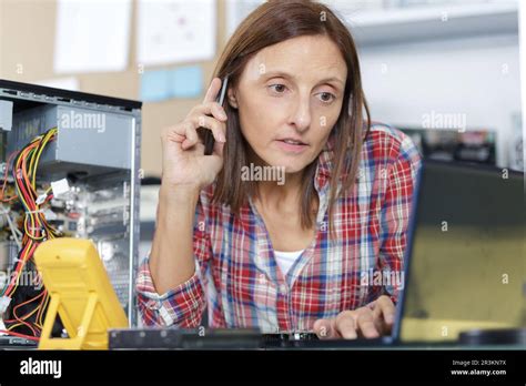 A Woman Measuring Electrical Current Stock Photo Alamy