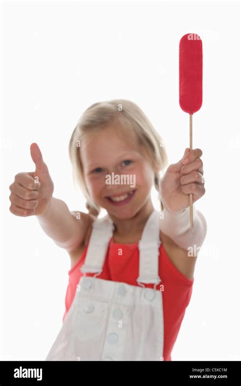 Girl 10 11 Holding Lollypop Rejoicing Thumbs Up Portrait Stock