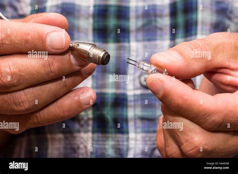 Man Changing Halogen Lamp Stock Photo Alamy