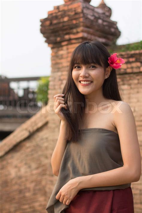 Beautiful And Charming Young Thai Girl With Thai Ancient Style Dressing