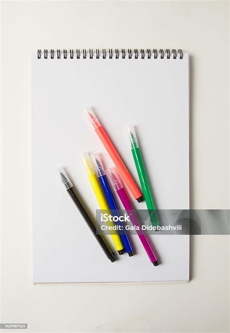 Watercolor Pens Brush Assortment On A Drawing Album Artists Desk Top