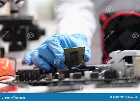 Installing Modern Central Processor Unit Into Motherboard Stock Image