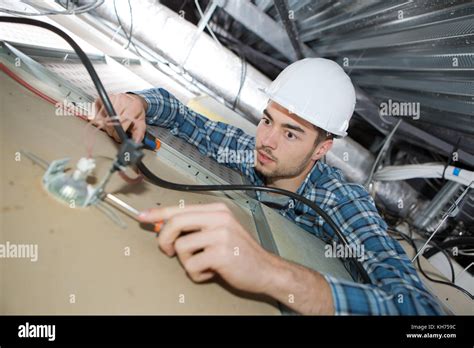 Electrician Repairing Ceiling Light Stock Photo Alamy