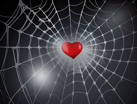 Premium Ai Image Red Heart Got Caught In Spider Web On Blurred Dark