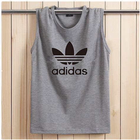 แนะนำรหัสผ้าฝ้ายผู้ชายเสื้อกั๊กแขนกุดนักเรียนขนาดใหญ่ข้ามแถบกีฬาเสื้อกั๊กผู้ชายหลวมtเสื้อลำลอง