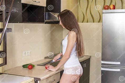 Woman Cutting Tomato In The Kitchen Stock Image Image Of Girl