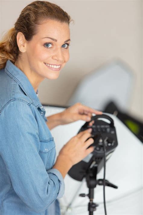 Female Photographer Setting Up Camera In Studio Stock Image Image Of