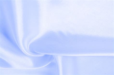 텍스처 배경 패턴입니다 블루 실크 직물 부드러운 우아한 블루 실크 또는 공단 직물 직물에서 만든 결혼식 배경으로 사용할 수 있습니다 럭셔리 크리스마스 배경 또는 새 해 배경