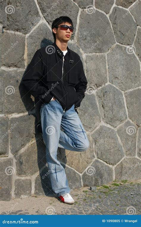 Asian Man Leaning Against A Wall Stock Image Image Of Male Model