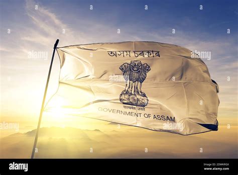 Assam State Of India Flag Waving On The Top Sunrise Mist Fog Stock