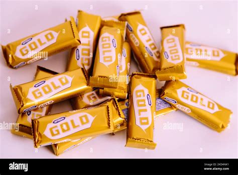 Stack Of McVities Gold Bars In Rough Pile Multiple Golden Chocolate