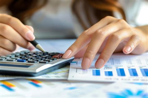 Premium Photo Female Accountant Calculating Business Data Using Pen And Calculator In Office