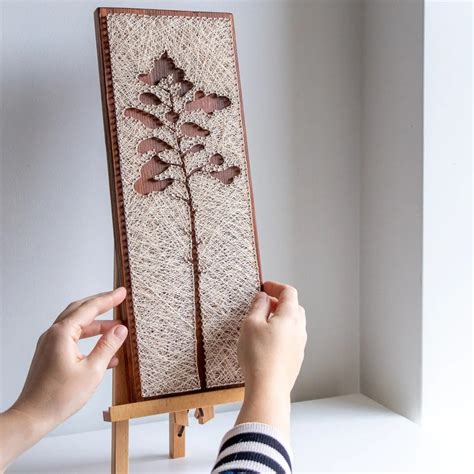 beginner friendly pine tree string art pattern for home decor