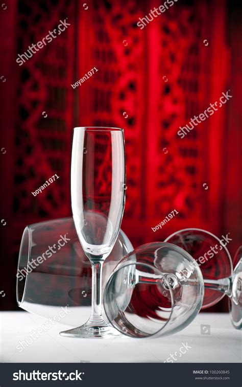 Champagne Wine Glass Standing On A Table With Red Wine Glass And White