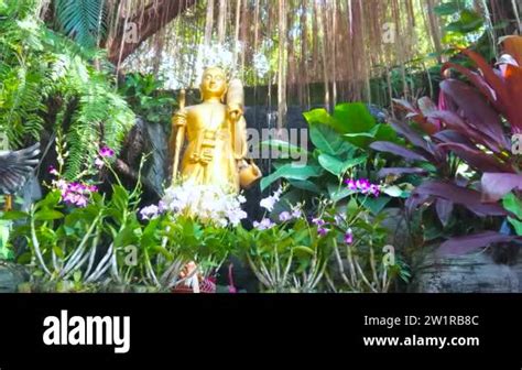 The Lush Garden Of Golden Mount Wat Saket Temple With Waterfall