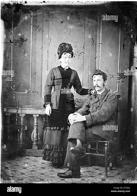 This Photograph Captures A Woman And A Man In An Intimate Reflective