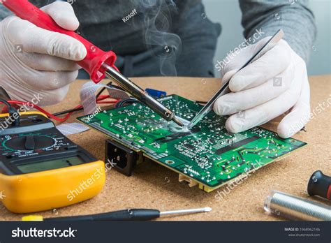 Technician Tin Soldering Circuit Board Over 1169 Royalty Free