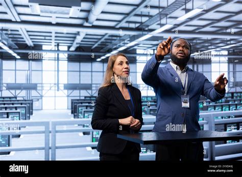 Coworkers Using Ar In Data Center Ensuring Cybersecurity And Efficient