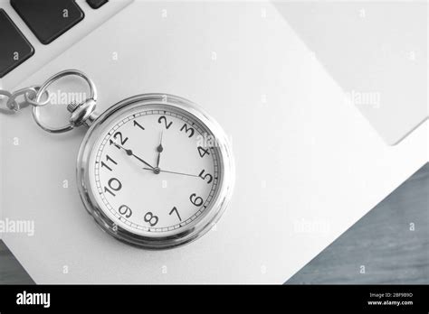 Clock On Laptop Closeup Time Management Concept Stock Photo Alamy