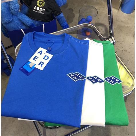 เสื้อยืดแขนสั้น พิมพ์ลายตัวอักษร Ader Error ทรงหลวม แฟชั่นฤดูใบไม้ผลิ