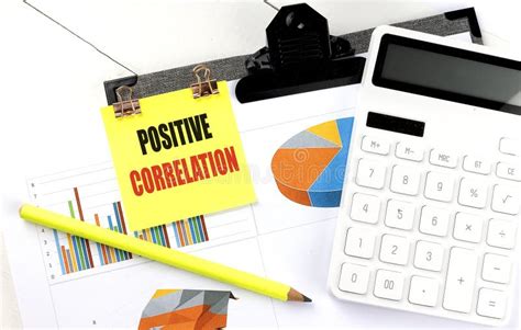 Positive Correlation Concept With Charts Calculator And Yellow Pencil