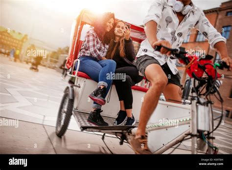 Shot Of Teenage Girls Taking Selfie On Tricycle Ride Young Female