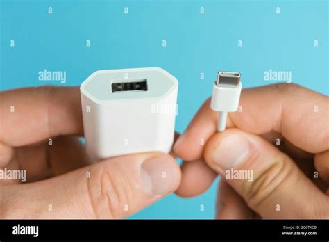 Usb Type C Cable And Usb Type A Adapter Plug In Mans Hands On The Blue Background Stock Photo