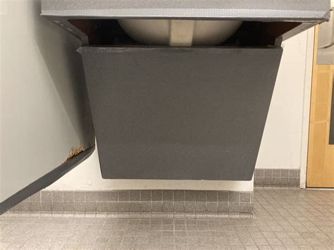 View Of Below The Sink With The Sink Insides Covered