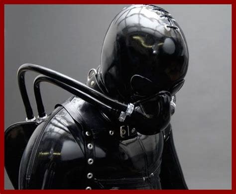 Guy In Tight Rubber Overalls With An Oxygen Mask Goldering