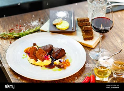 Deer Tenderloin Truffle Potato Puree Porcini Mushrooms Baked Leek And Carrot Juniper Bread